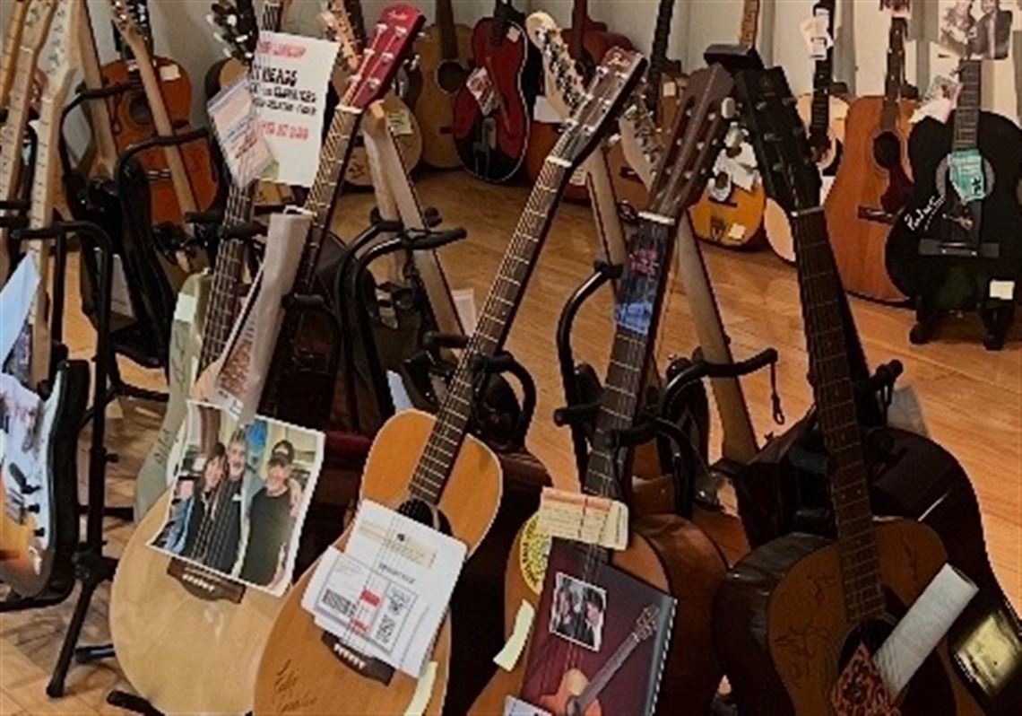 Rich Engler's signed guitar collection is on display and up for bid ...